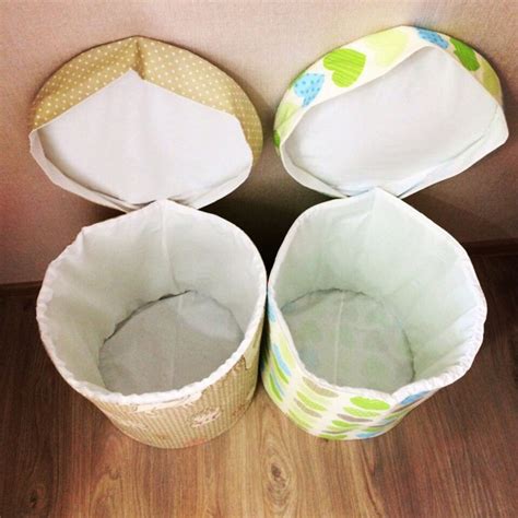 three paper containers sitting on top of a wooden floor