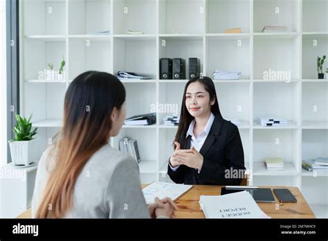Financial Analysts Analyzing Business Reports On Planned Investment