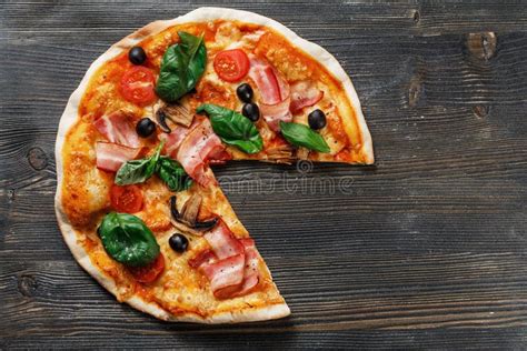 Top View Of Italian Pizza With Mushrooms Basil Tomato Olives And