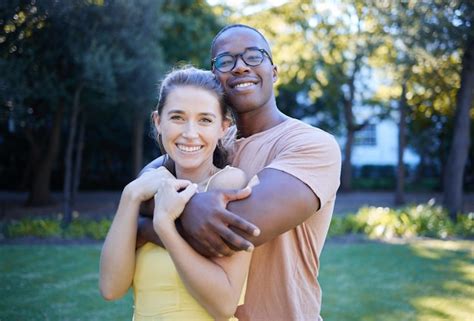 Premium Photo Couple In Portrait Date In Park With Hug And Outdoor In