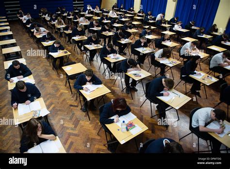 Welsh Teenage Gcse School Pupils Sitting Exams In A School Hall Stock