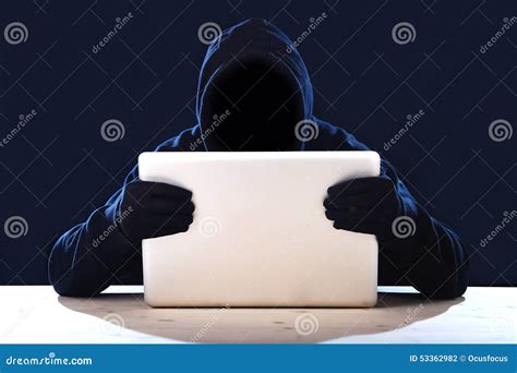 Hacker Man In Black Hood And Mask With Computer Laptop Hacking System In Digital Intruder Cyber