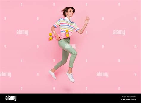 Full Body Profile Side Photo Of Young Girl Go Run Jump Hold Skateboard