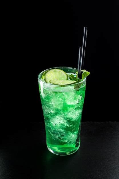Premium Photo Close Up Of Drink In Glass Against Black Background