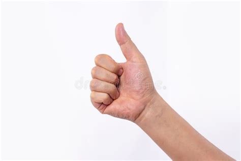 Closeup Of Male Hand Showing Thumbs Up Sign Against White Background