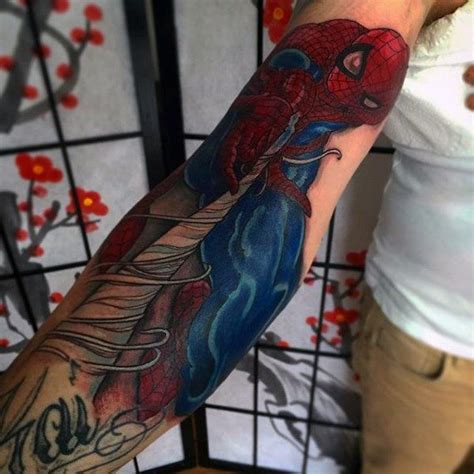 A Man With A Spiderman Tattoo On His Arm