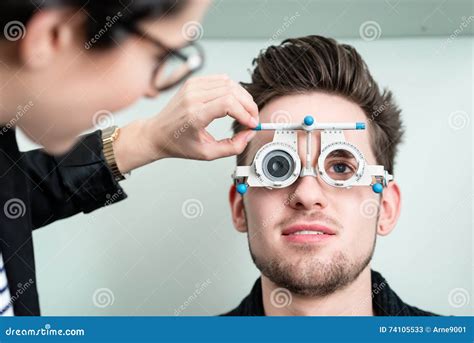 Man With Optician At Eyesight Test For Glasses Stock Image Image Of