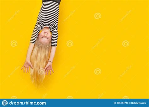 Excited Crazy Little Blonde Girl Hanging Happy Upside Down Hands Up