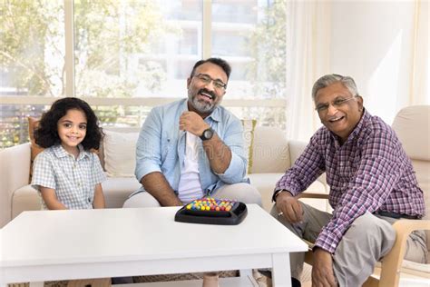Happy Indian Granddaughter Grandpa And Great Granddad Posing For