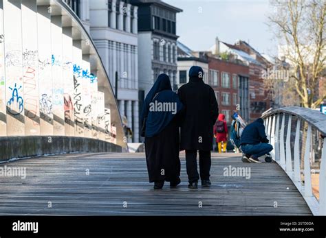 People Walking Over The Suzan Daniel Bridge In Molenbeek Brussels