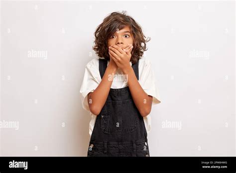 Portrait Of Shocked Dark Skinned Brunette Young Guy With Wide Opened