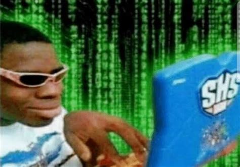 A Man Wearing Sunglasses Is Looking At A Computer Screen With The Word