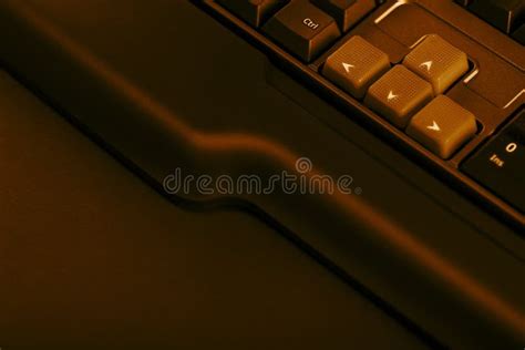 Orange Arrow Keys On A Black Keyboard Up Down Left Right Buttons On A Gaming Computer