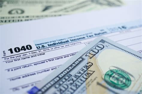 Premium Photo Tax Return Form 1040 And Dollar Banknote U S