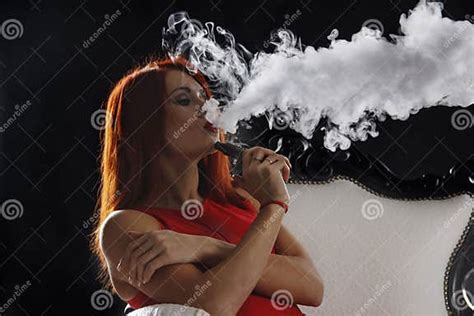 Woman Smoking Electronic Cigarette Vape Mod Concept Stock Image