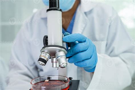 Asian Scientist Biochemist Or Microbiologist Working Research With A