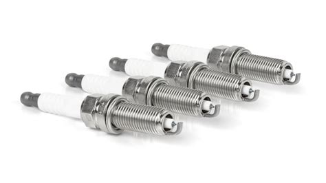 Premium Photo Four Iridium Spark Plugs In A Row