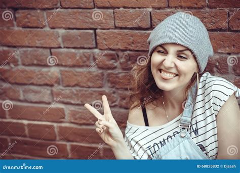 Young Fashion Hipster Girl Posing On The Street Near Old Brick W Stock