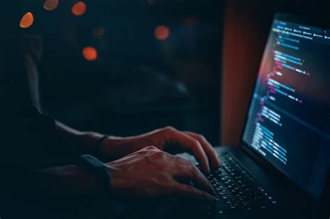 Premium Photo A Young Male Developer Is Programming A Code Script