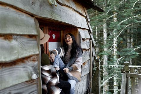 Two Friends Spending Time At Treehouse By Stocksy Contributor