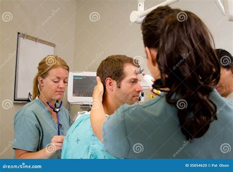 Nurse Assessing Stroke Victim By Raising Arms Stock Image 86287243