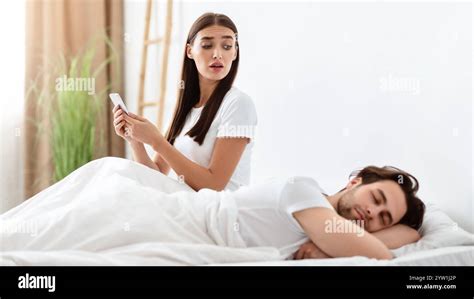 Jealous Wife Checking Husbands Phone While He Sleeping In Bedroom