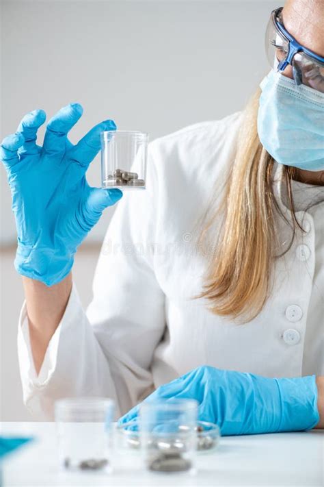 Medical Innovation As A Scientist Meticulously Prepares Fecal Transplant Caps In The Lab