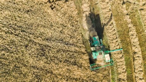 Harvester Machine Working In Field Aerial View From Above Combine