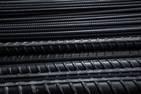 Premium Photo Stack Of Heavy Metal Reinforcement Bars With Periodic