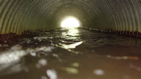 Surface Water Or Stormwater Runs Through Corrugated Overflow Pipe Low