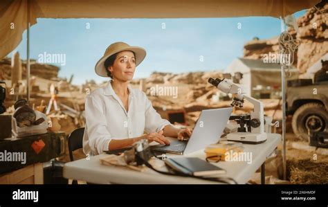 Archaeological Digging Site Beautiful Female Archaeologist Doing Research Using Laptop