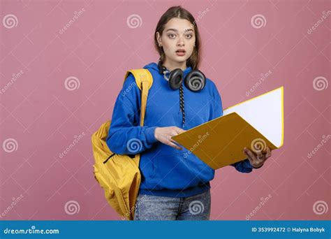 Pretty Schoolgirl Standing With Open Mouth Looking At Camera Stock
