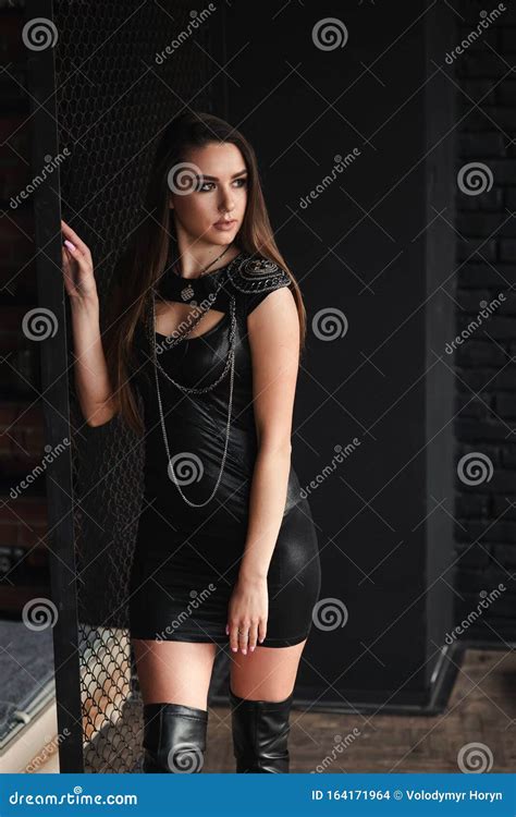 Urban Stylish Girl In Sexual Leather Dress Near Metal Grid Stock Photo Image Of Leather