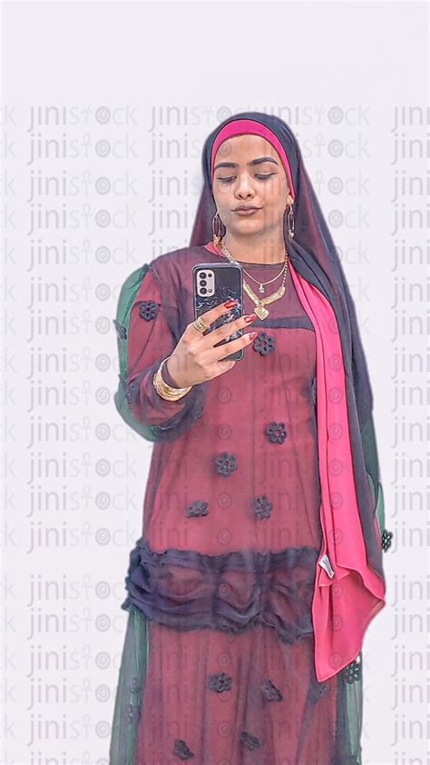 An Egyptian Farmer Or A Nubian Girl Wearing A Nubian Outfit Holding A