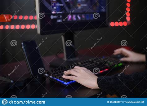 Young Female Professional Streamer And Gamer With Headset Playing