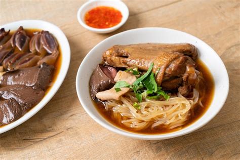 Premium Photo Braised Duck Noodles With Brown Soup