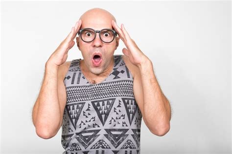 Premium Photo Portrait Of Bald Nerd Man With Eyeglasses Looking Shocked