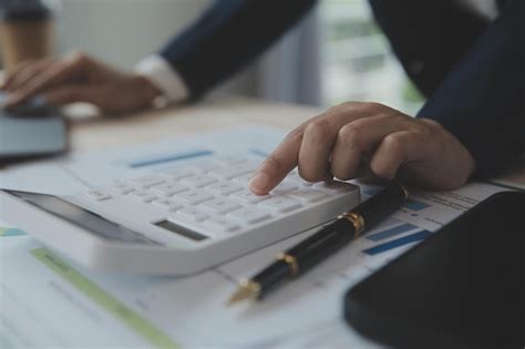 Premium Photo Close Up Business Woman Using Calculator And Laptop For