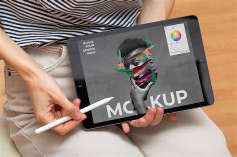 Premium Psd Model Holding Tablet And Pencil Flat Lay