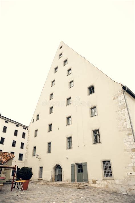 A Striking Triangular Historic Building With Medieval Architecture And Multiple Windows Located