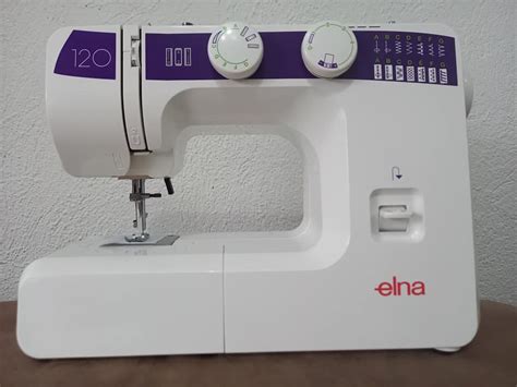Elna 120 Домашна машина за шиење и везење Машината има 15 различни везови за шиење и везење