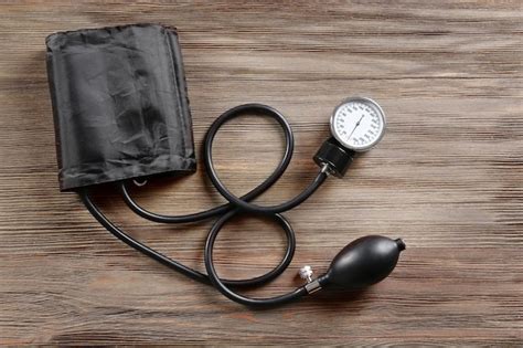 Premium Photo Medical Manometer On A Wooden Background