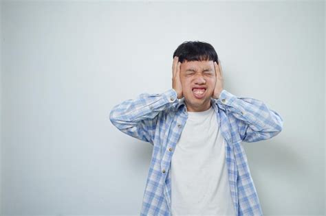 Premium Photo Facial Expressions Of Asian Men Who Feel Uncomfortable