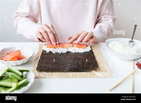 Sushi Preparation Process The Girl Makes Sushi With Different Flavors Fresh Salmon Caviar