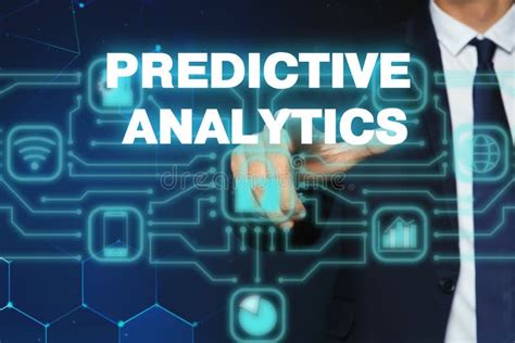 concept of predictive analytics businessman pointing at phrase on