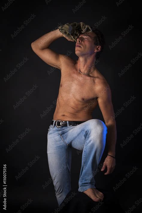 Isolated Shirtless Sweaty Man In Jeans Black Background Blue Grazing