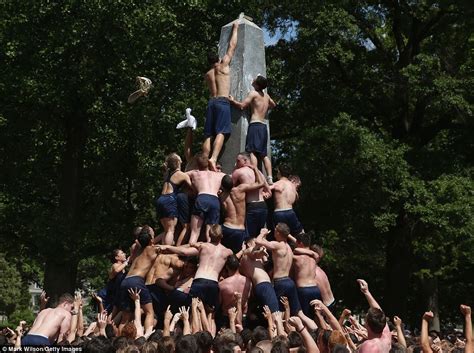 Annapolis Naval Academy Freshmen Place Officers Hat Atop Lard Covered