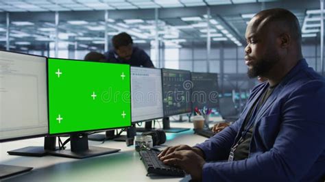 Engineer Using Green Screen Computer Working In Server Farm Stock Video Video Of Coding