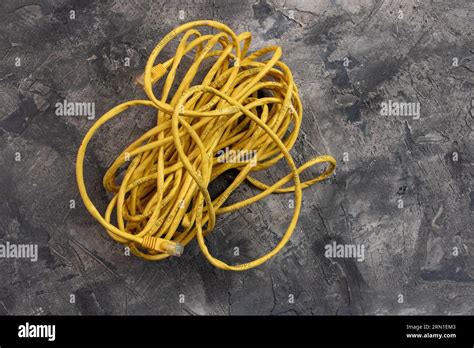Long Yellow Ethernet Cable For Computing Networking In A Bit Of A
