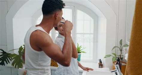 Happy Couple Dancing Or Brushing Teeth With Toothbrush In Bathroom For Morning Routine At Home